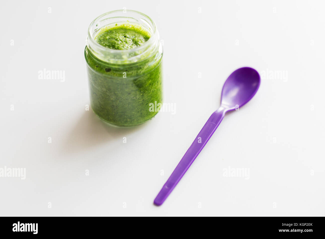 jar of vegetable puree or baby food and spoon Stock Photo - Alamy