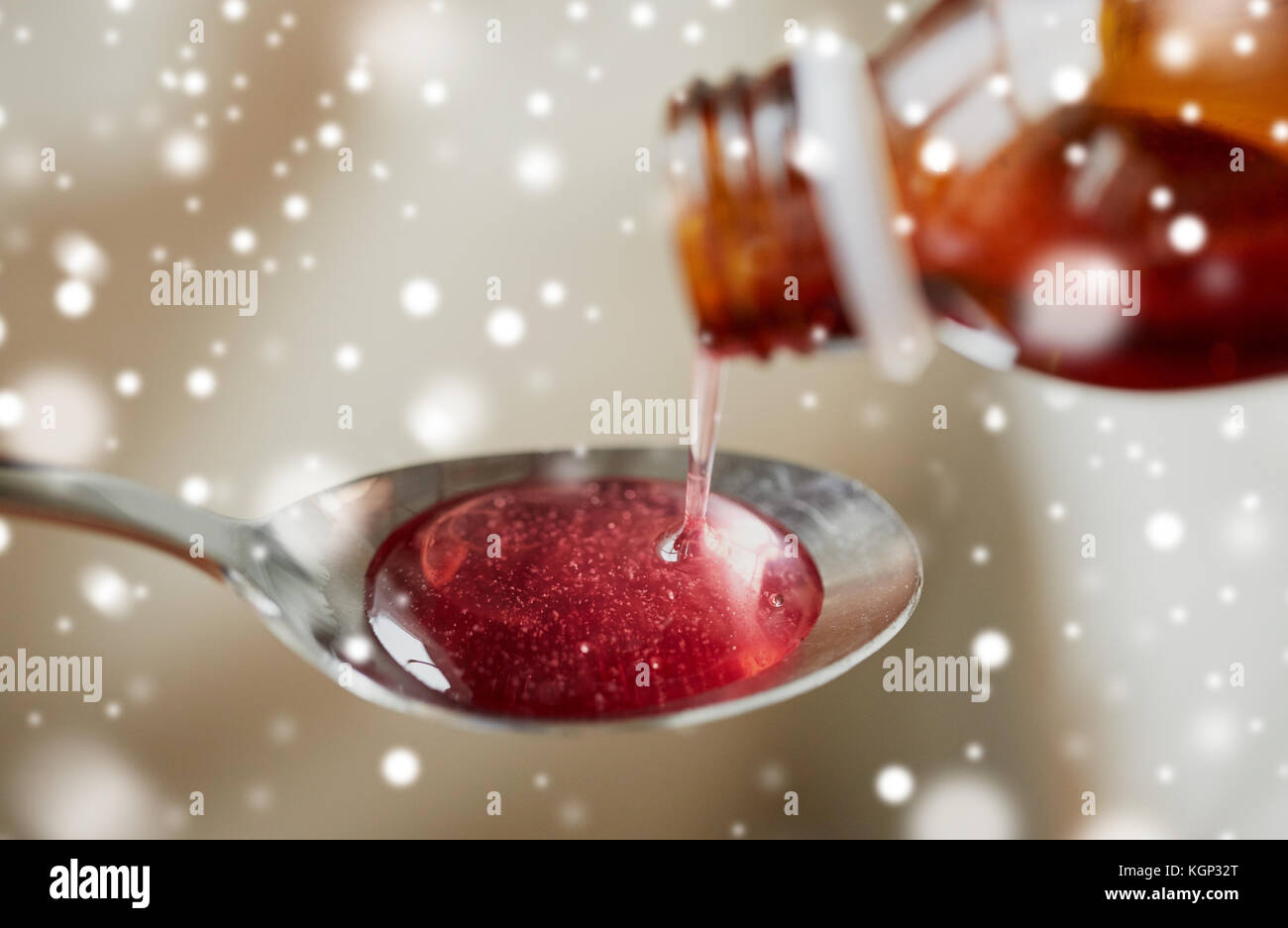medication or antipyretic syrup and spoon Stock Photo - Alamy
