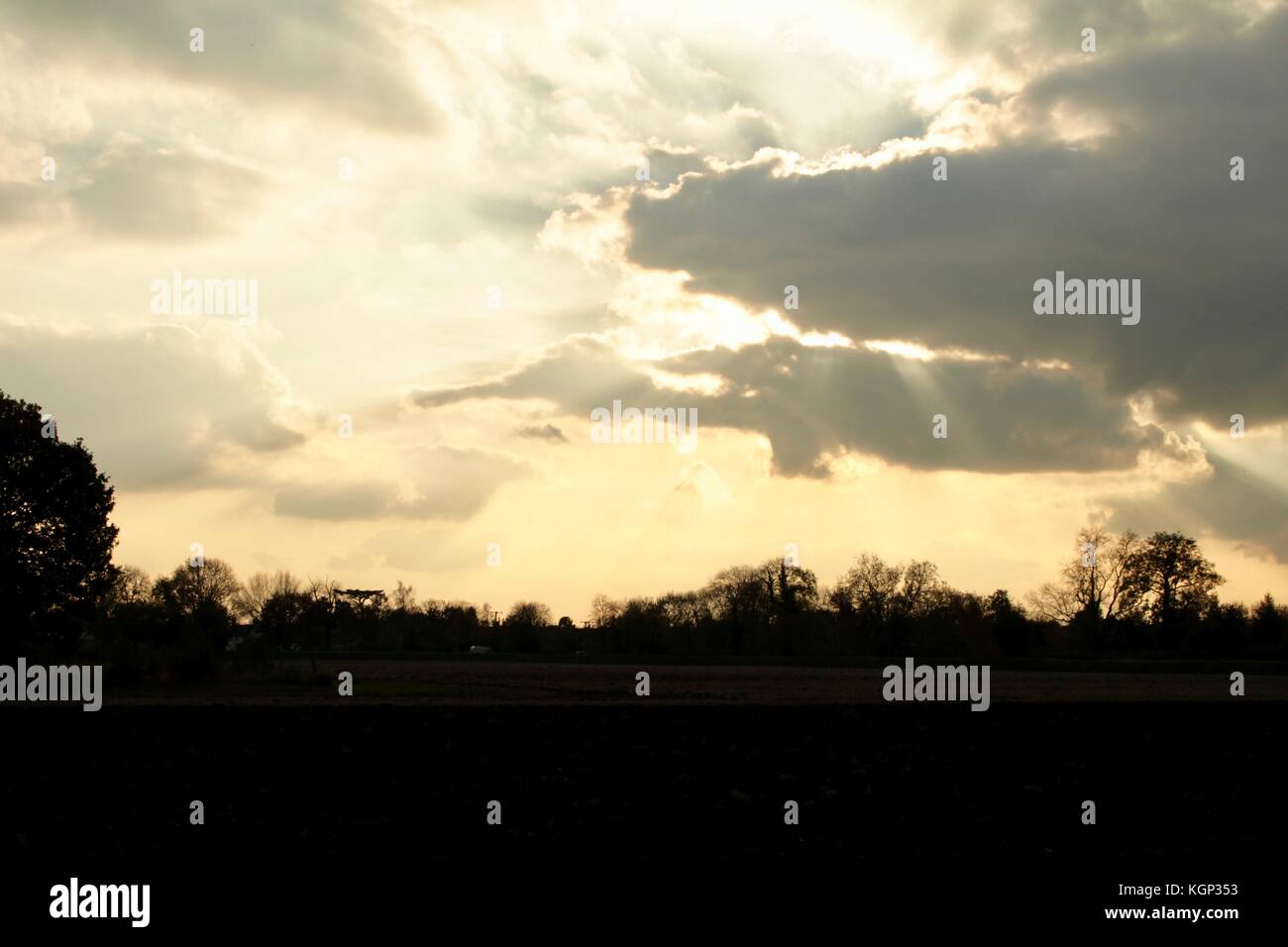 Sun setting behind big hi-res stock photography and images - Alamy