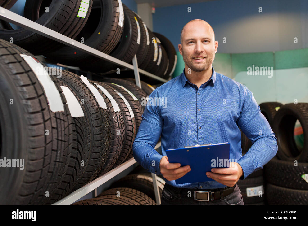 auto business owner and wheel tires at car service Stock Photo - Alamy