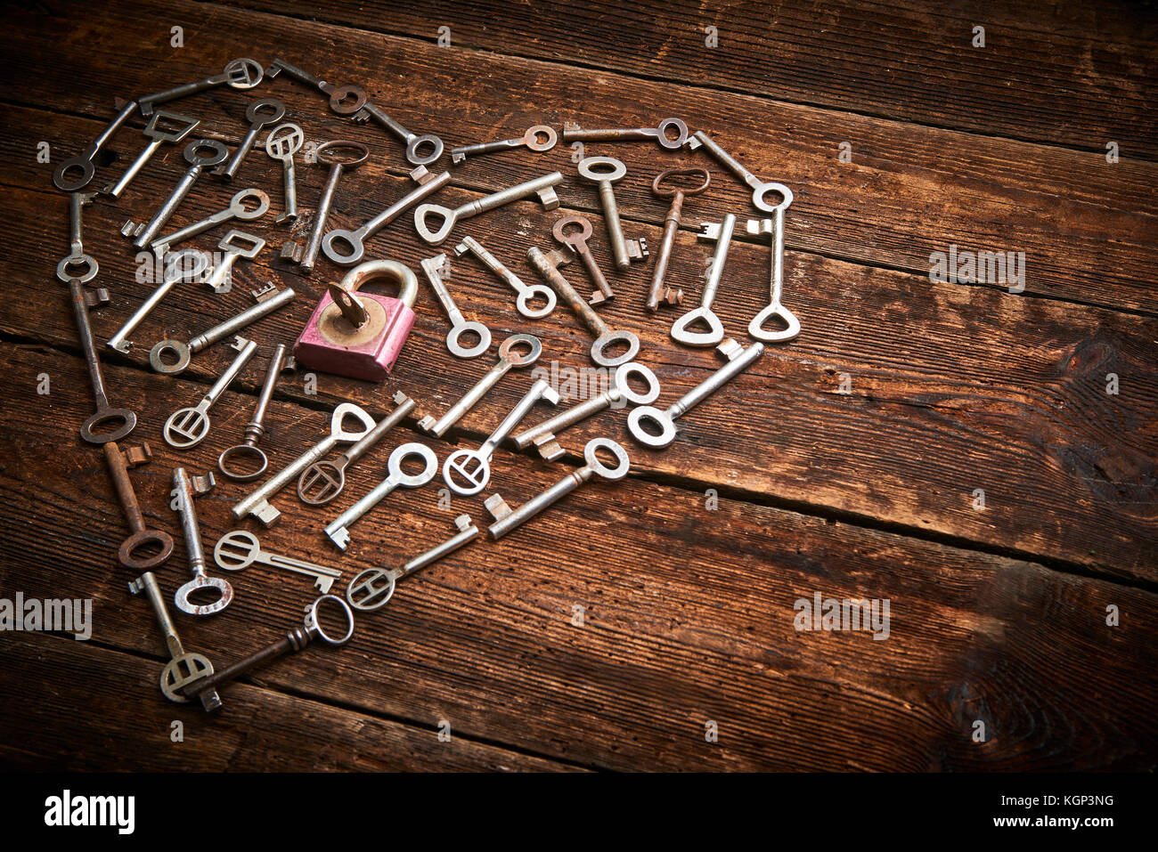 Old keys in a heart shape, on a wood surface, vintage look Stock Photo ...