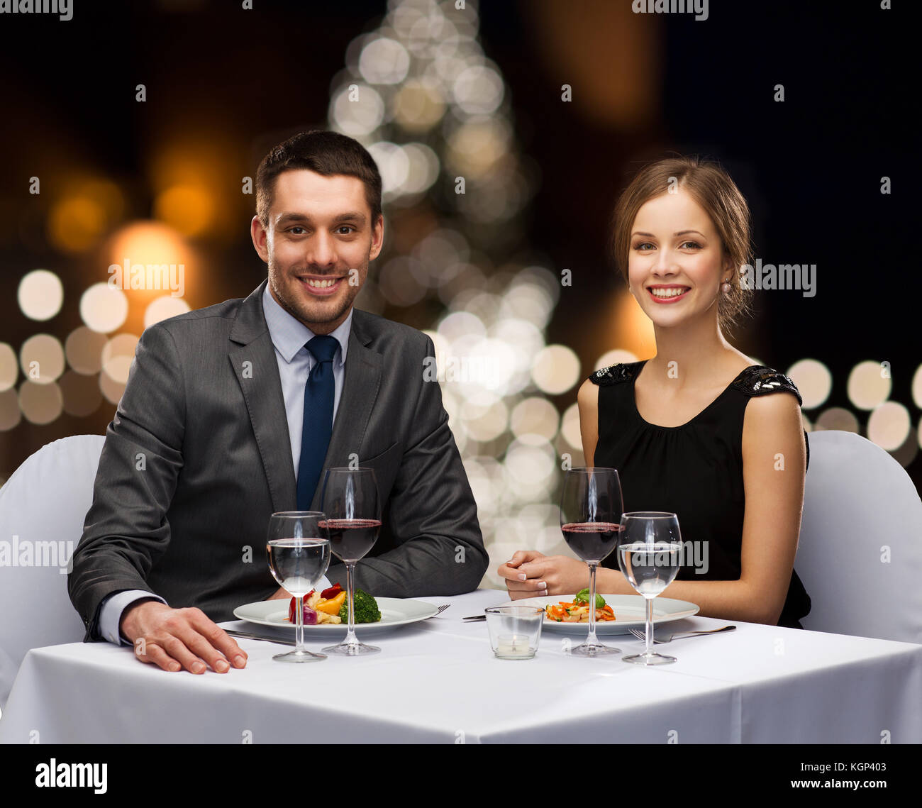 couple at served restaurant table at christmas Stock Photo - Alamy