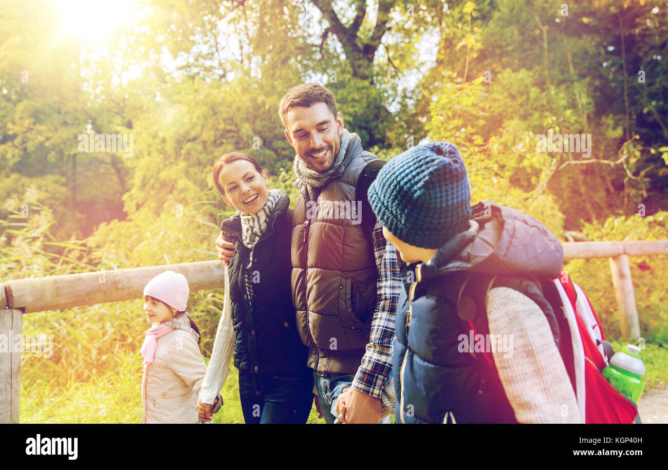 happy family with backpacks hiking Stock Photo - Alamy