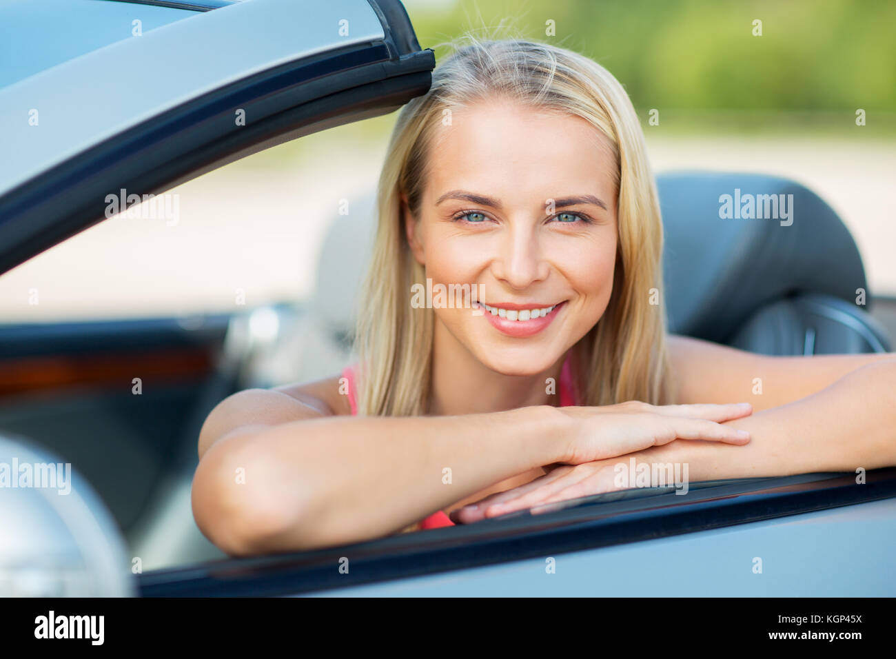 happy young woman in convertible car Stock Photo - Alamy