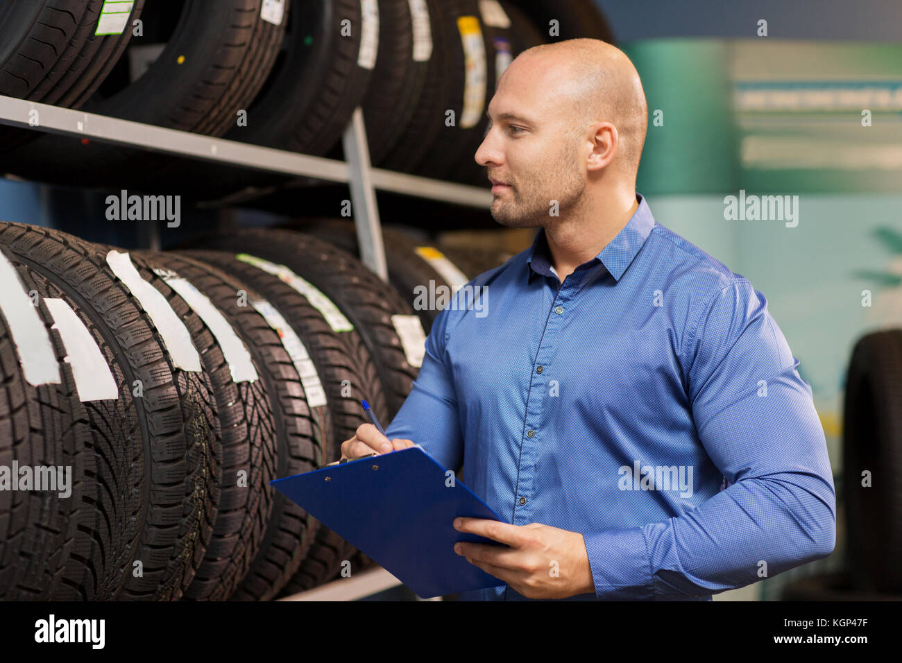 auto business owner and wheel tires at car service Stock Photo - Alamy