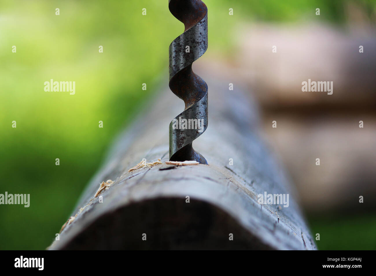 Metal spiral drill for making holes in logs when assembling a wooden ...