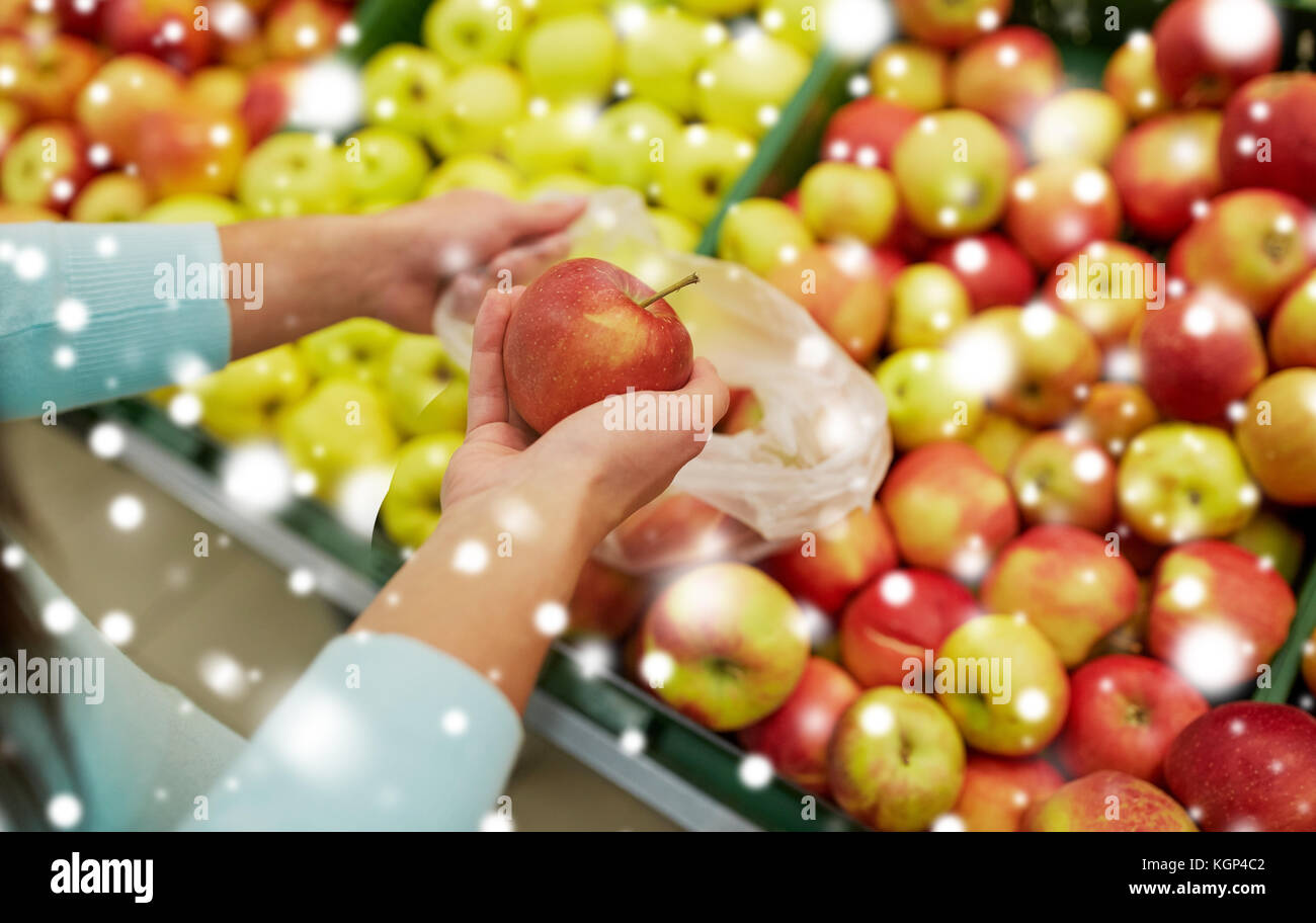 sale, shopping, food, consumerism and people concept - woman with bag ...