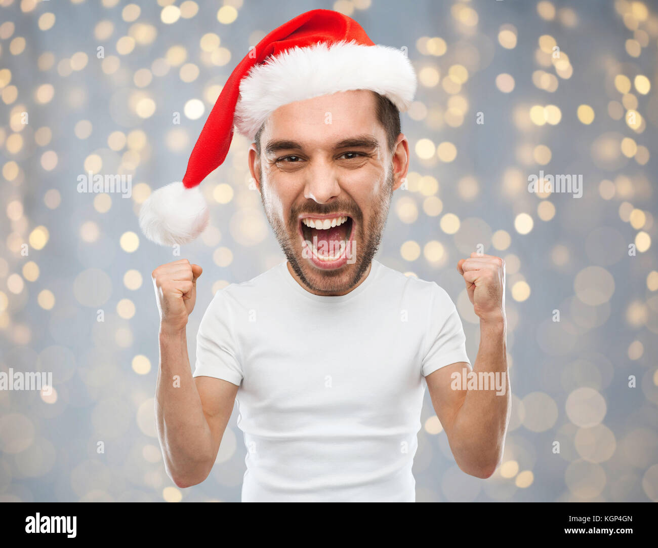 christmas, holidays and people concept - screaming man in santa hat ...