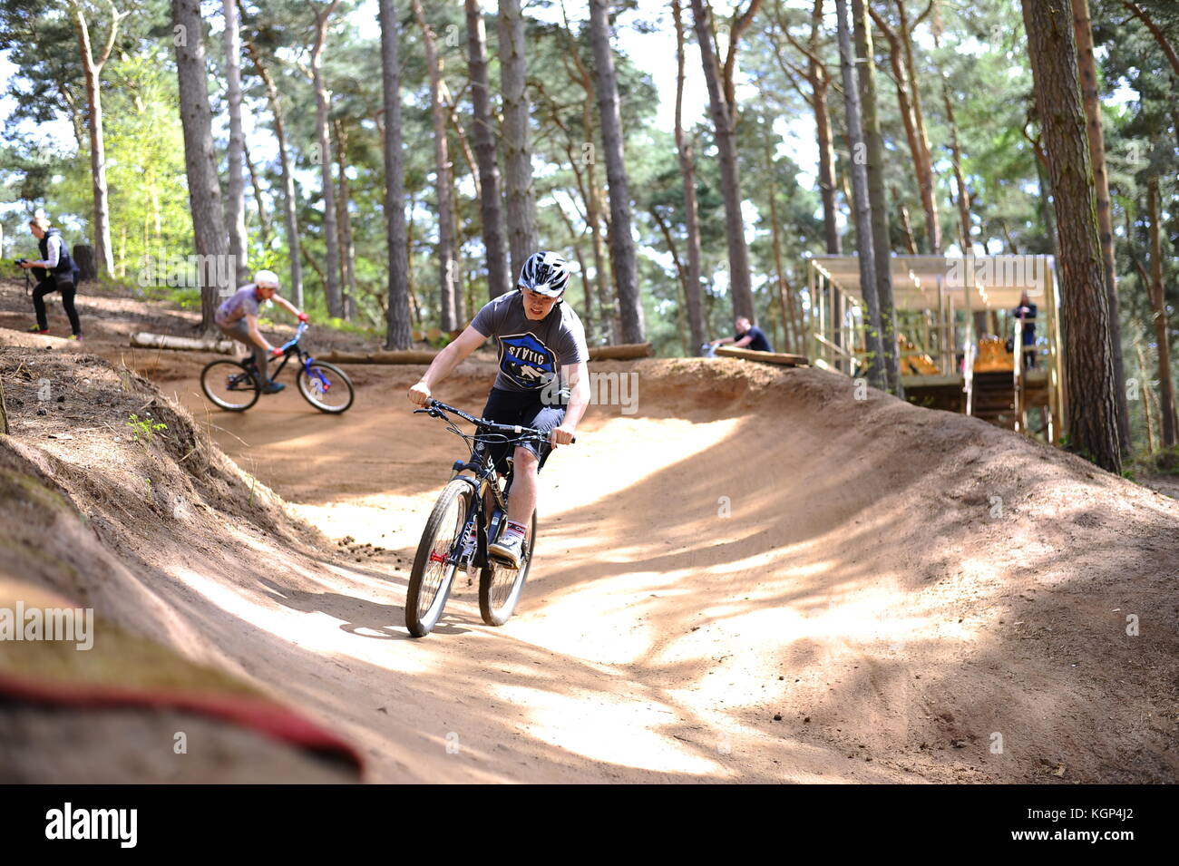 Mountain biking at Chicksands, Bedfordshire. Riders descending down a ...