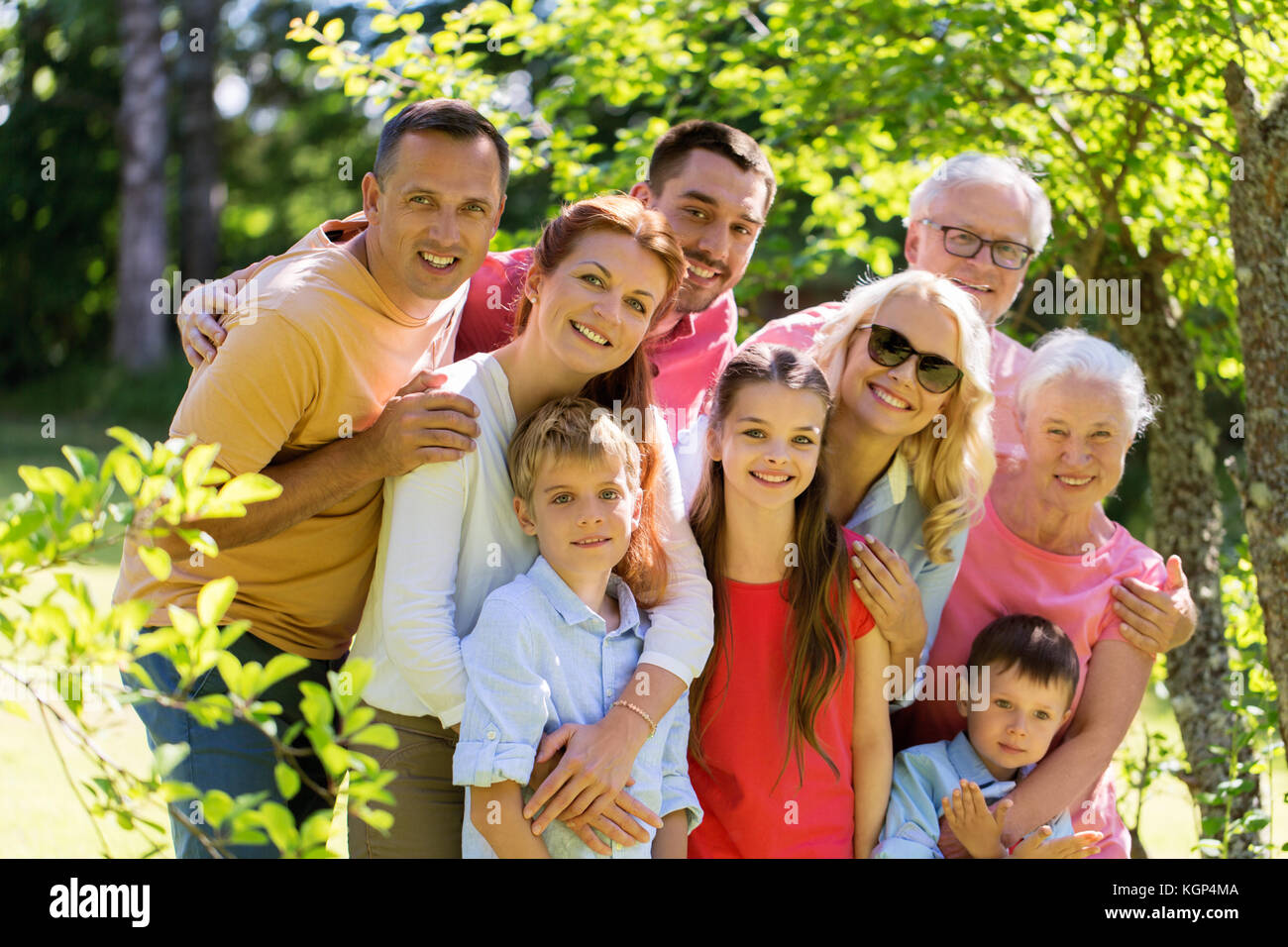 generation and people concept - happy family portrait in summer garden ...
