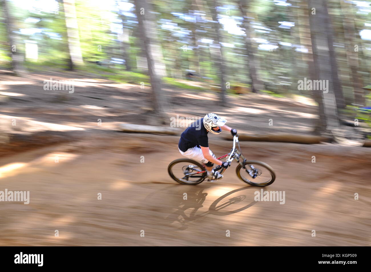 Mountain biking at Chicksands, Bedfordshire. Riders descending down a ...