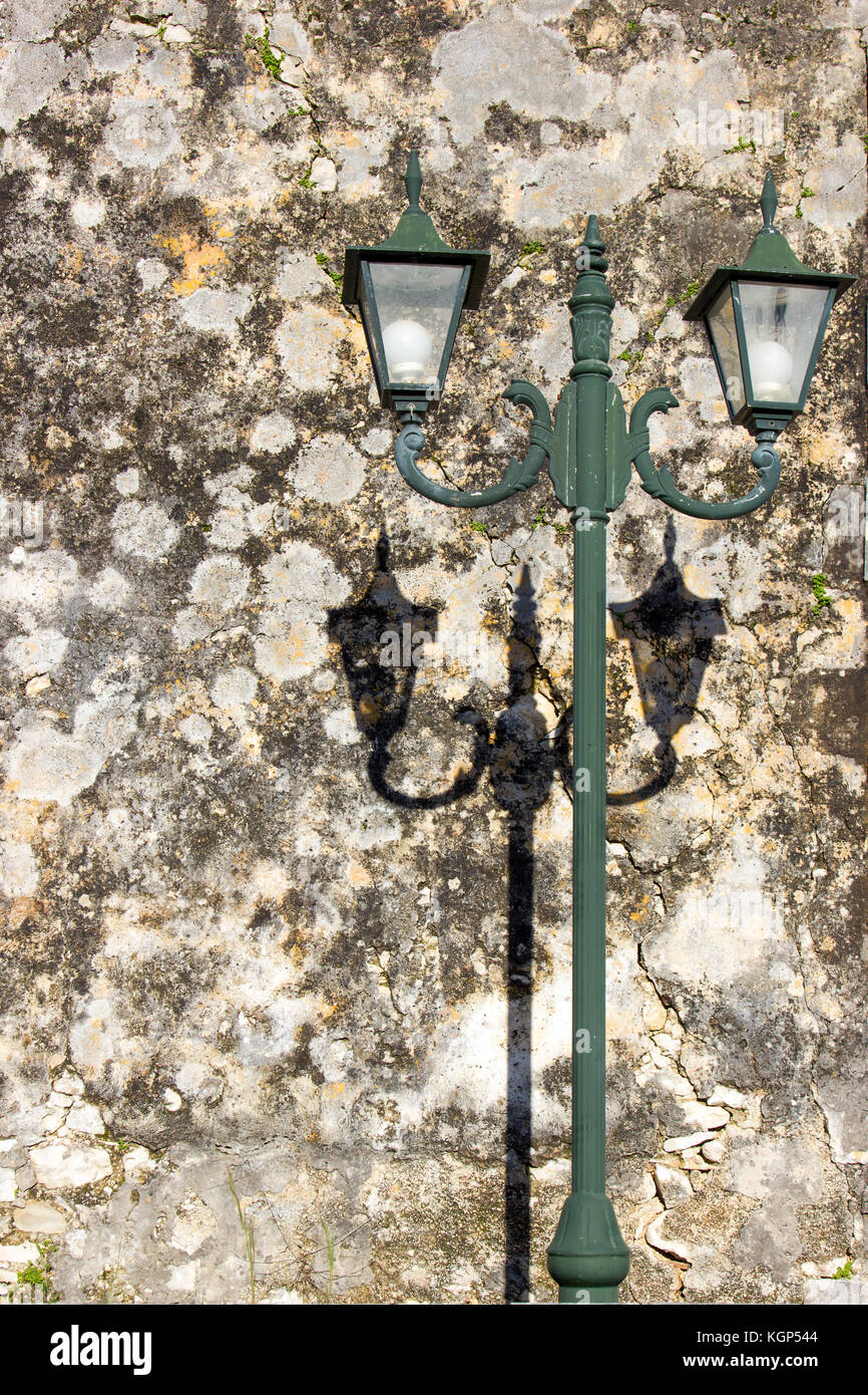 big lantern and an old wall with fade colors Stock Photo - Alamy