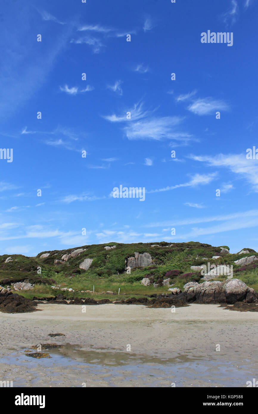 Pale sand and blue skies above an island on the Wild Atlantic Way ...