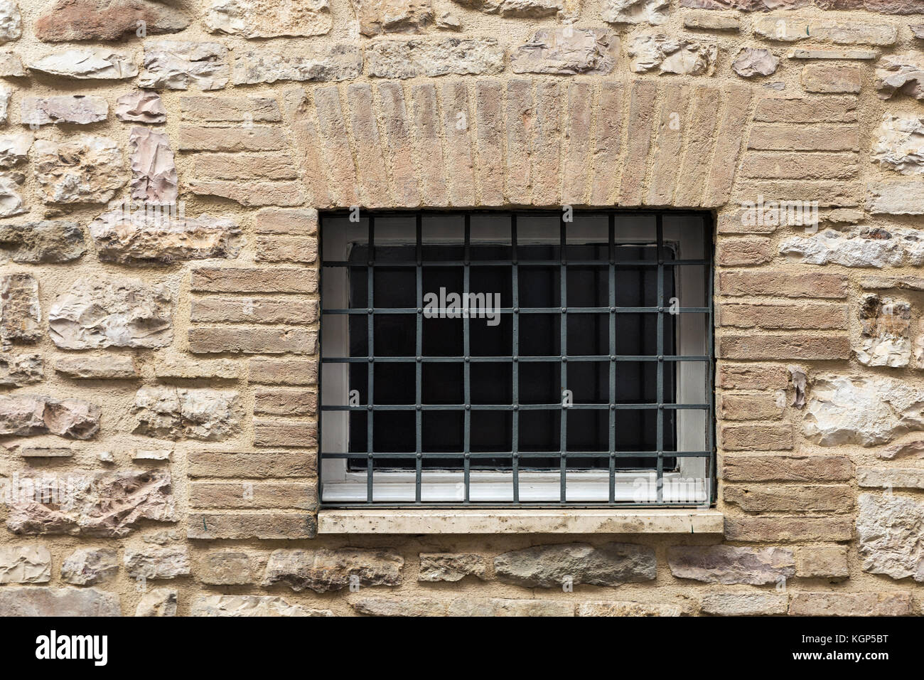 Assisi (Italy): Window on medieval stone wall Stock Photo - Alamy
