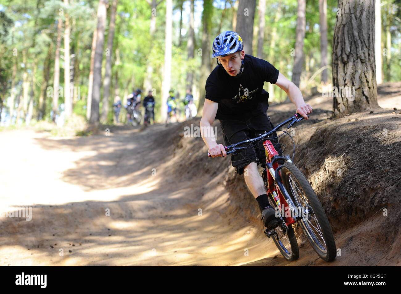 Mountain biking at Chicksands, Bedfordshire. Riders descending down a ...