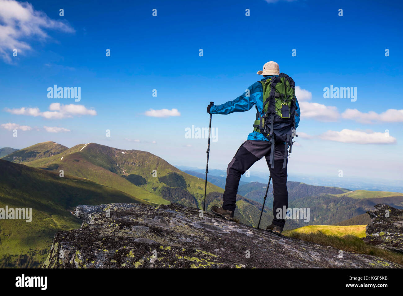 Hiker outdoor with equipment on mountain rock, nature mountain ...