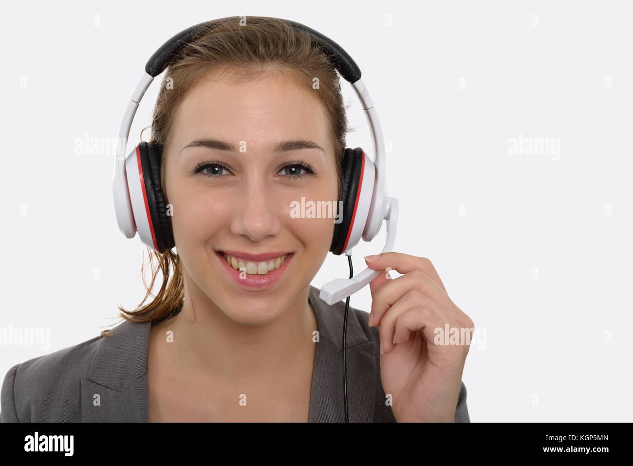 a beautiful smiling young woman with a headset, on white background ...