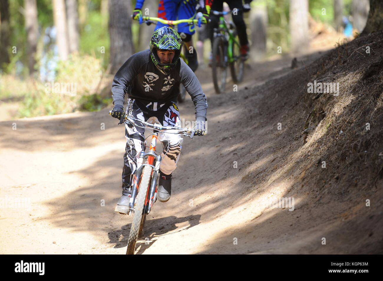 Mountain biking at Chicksands, Bedfordshire. Riders descending down a ...
