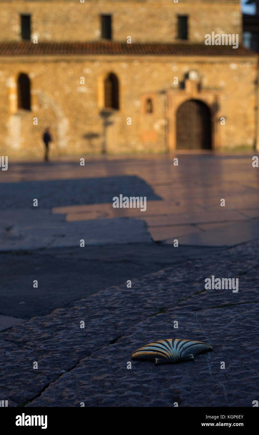 A brass scallop shell along the route of the camino to Santiago de ...