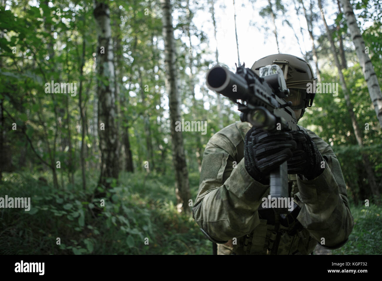 Picture of soldier in helmet with submachine gun Stock Photo - Alamy
