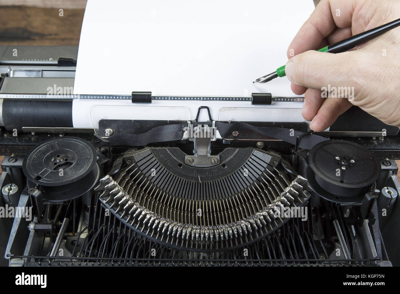 Old typewriter from seventies with paper and copy space. With writing ...