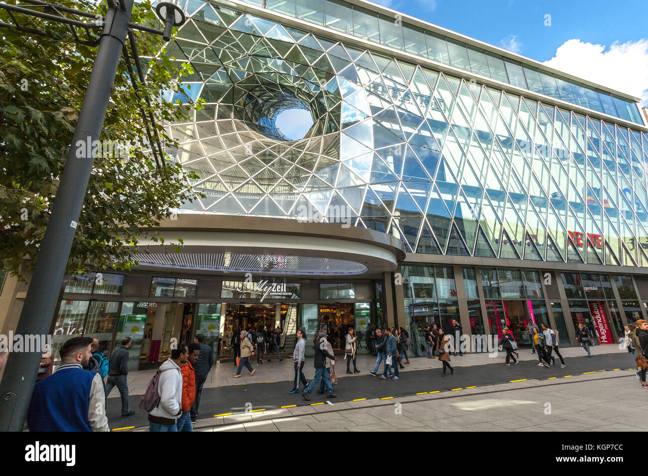Shopping center building architecture with a hole in the wall in ...