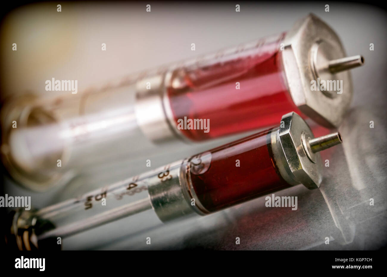 Vintage Syringe Detail Full Of Blood, Conceptual Image Stock Photo - Alamy
