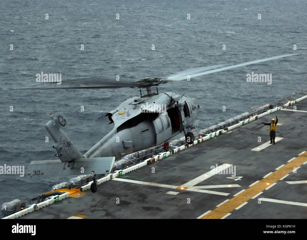 A U.S. Navy MH-60S Seahawk with Helicopter Sea Combat Squadron (HSC) 28 ...