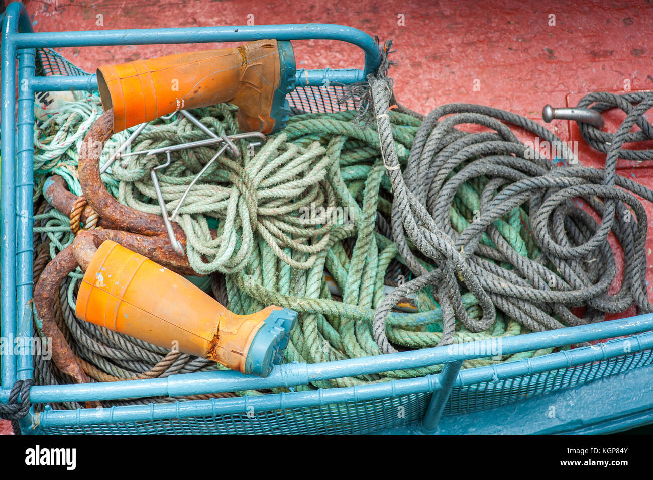 Fishing Boat Ropes and Boots Stock Photo - Alamy