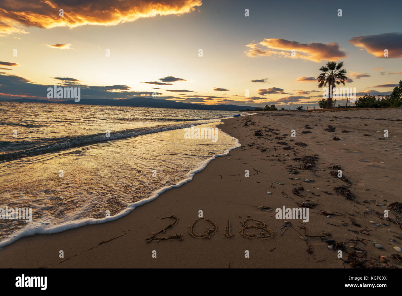 2018 written on sandy hi-res stock photography and images - Alamy