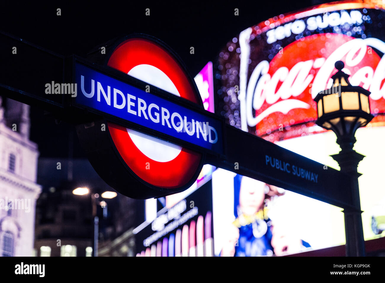 Underground tube sign at Piccadilly Circus at night in West End London ...