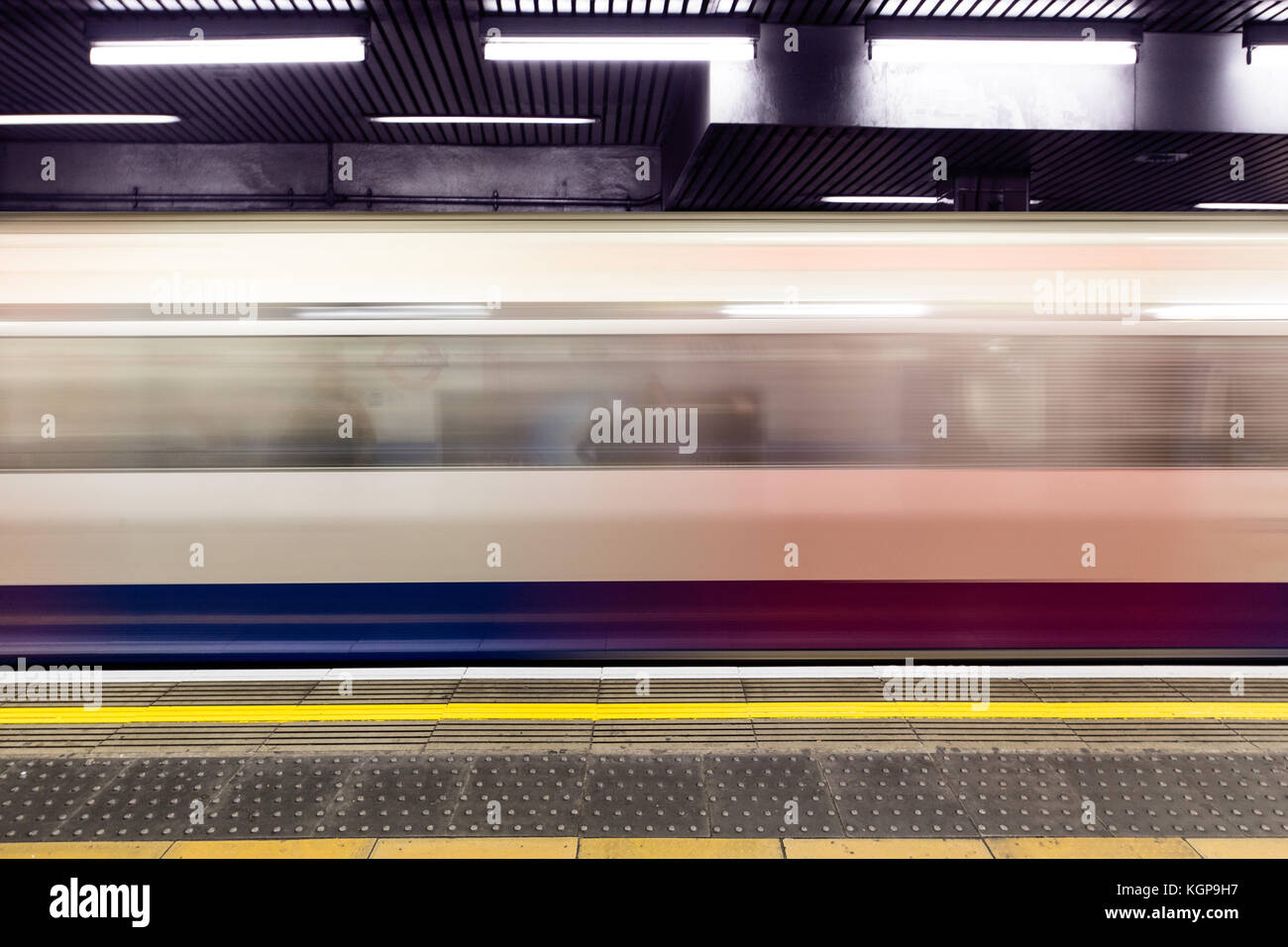 Moving train arriving on platform on London Underground tube train ...