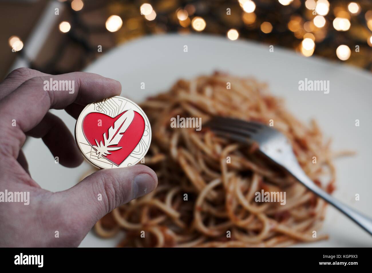 Digital currency physical gold feather coin. Italian pasta food concept ...