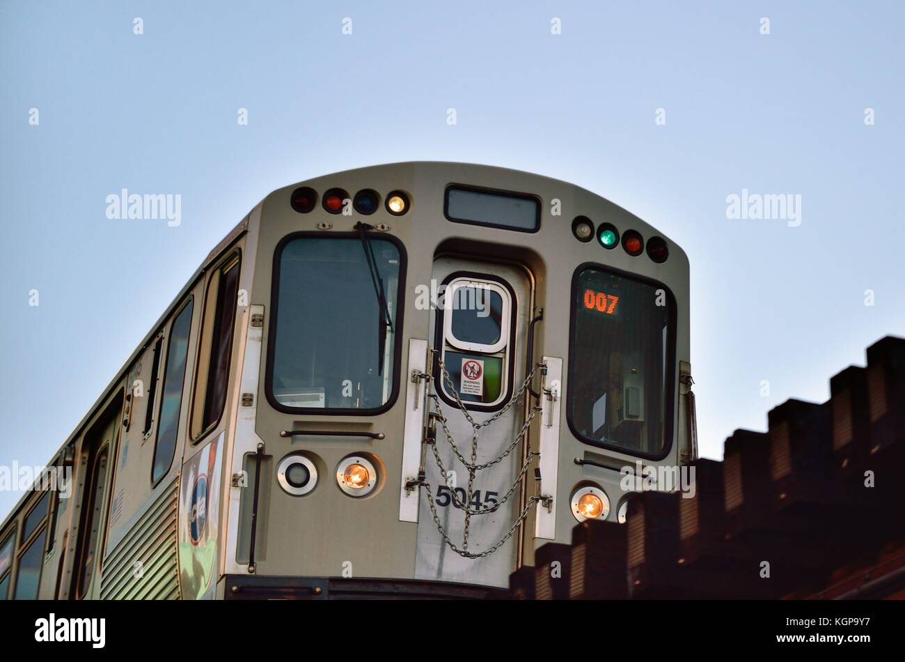 A Chicago CTA rapid transit L train negotiates through a curve above ...