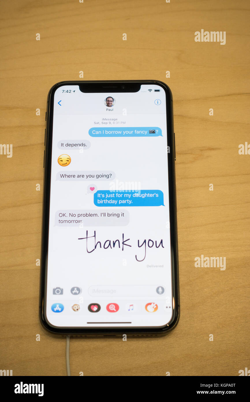 Message screen displayed on a new iPhoneX Stock Photo - Alamy