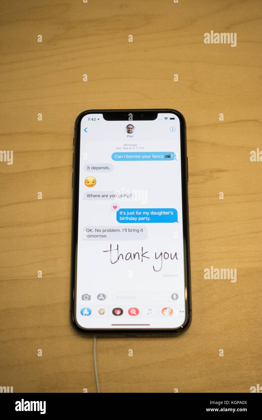 Message screen displayed on a new iPhoneX Stock Photo - Alamy
