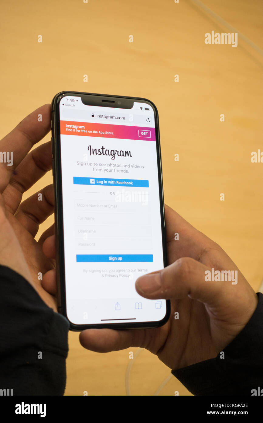 Person logging in into the Instagram account on an iPhone X Stock Photo ...
