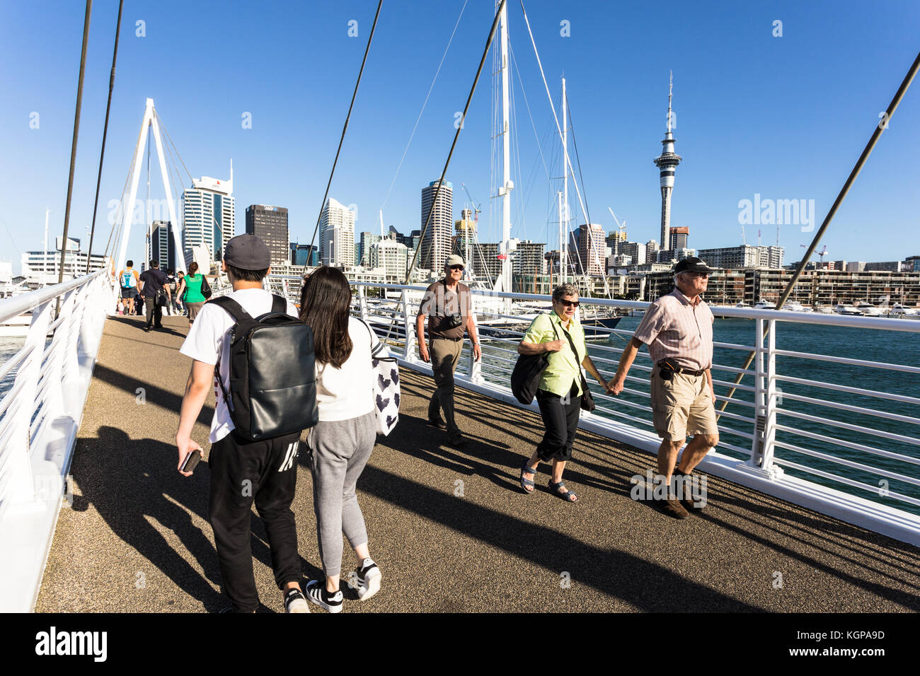 AUCKLAND, NEW ZEALAND - MARCH 1, 2017: People walk across the bascule ...