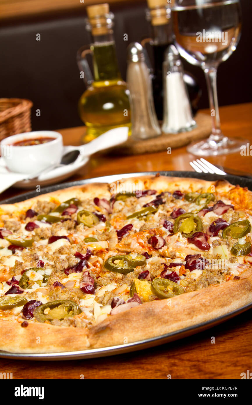 Fresh baked pizza with ground beef, chilli peppers and beans Stock ...