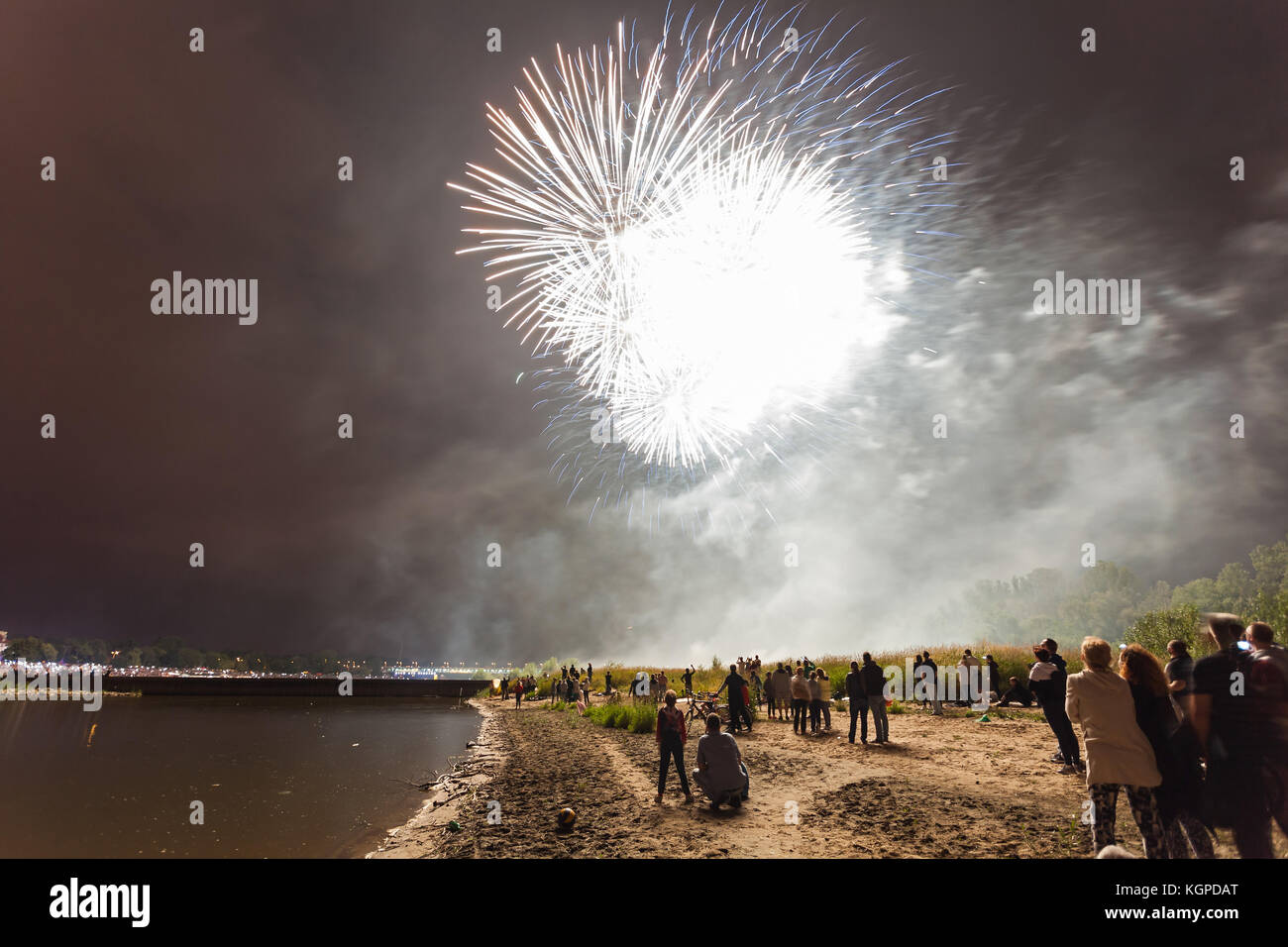 People watching firework show Stock Photo - Alamy