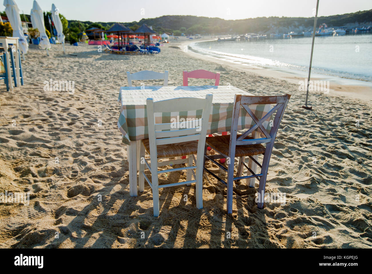 Greek taverna tables on the beach , traditional restaurant in the ...