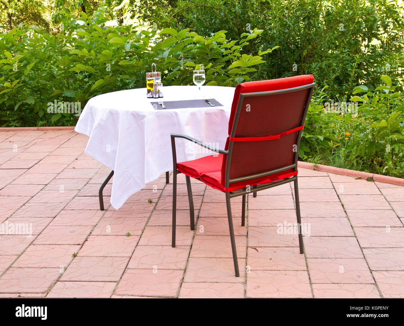 Table on the terrace with dinner setting Stock Photo - Alamy