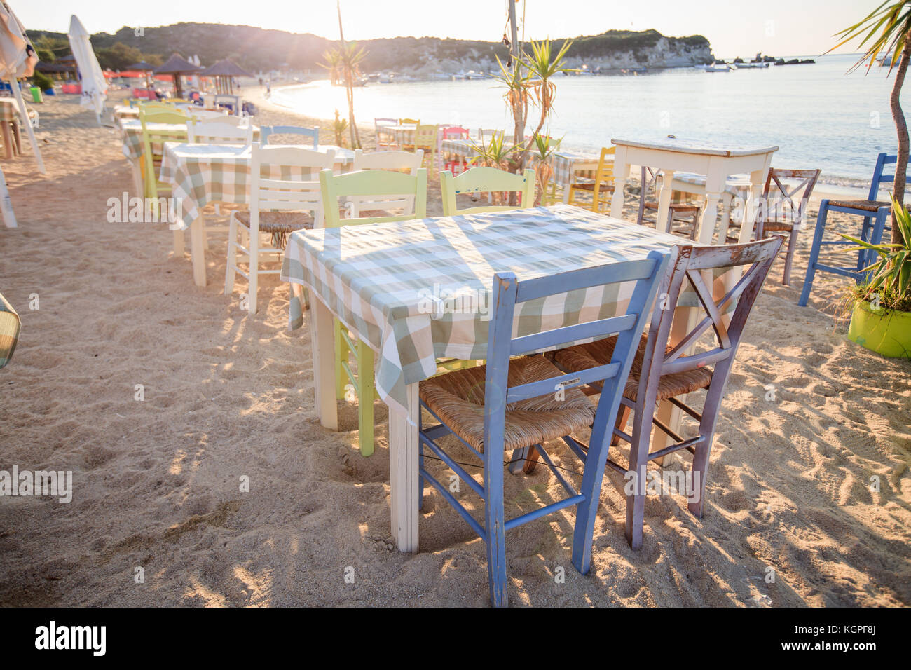 Greek taverna tables on the beach , traditional restaurant in the ...