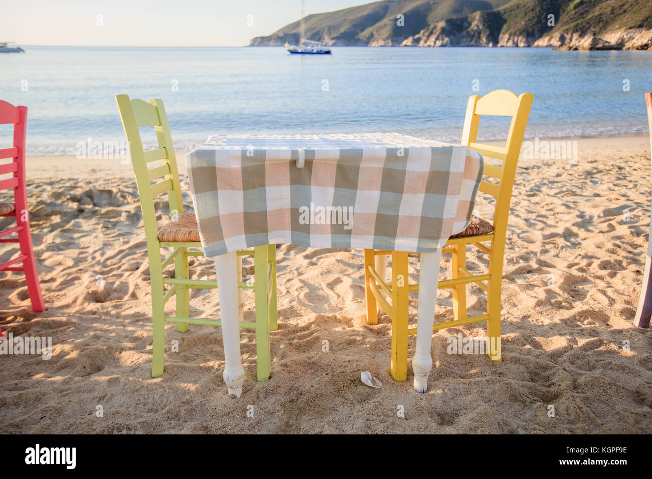 Greek taverna tables on the beach , traditional restaurant in the ...