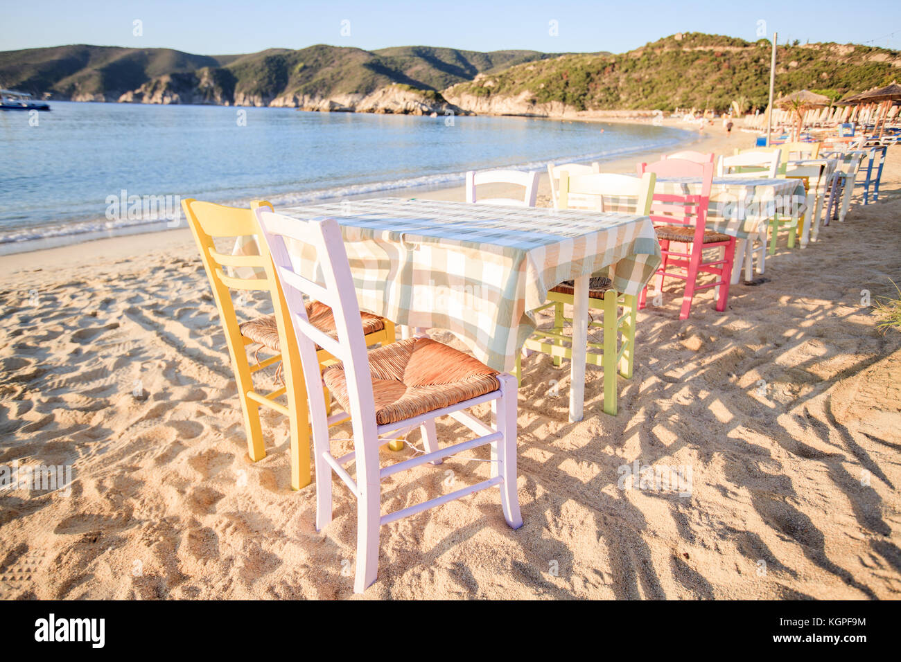 Greek taverna tables on the beach , traditional restaurant in the ...