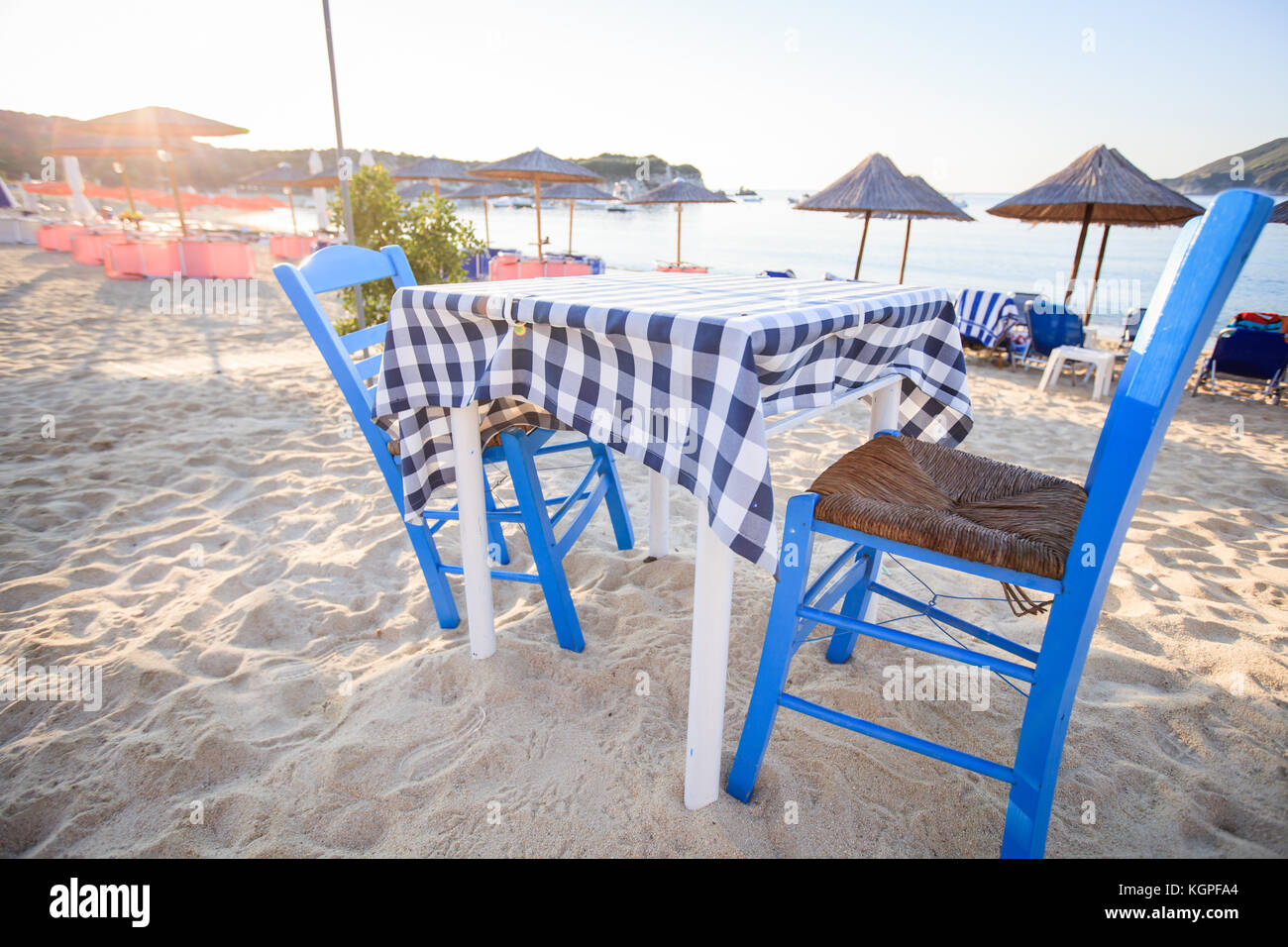 Greek taverna tables on the beach , traditional restaurant in the ...