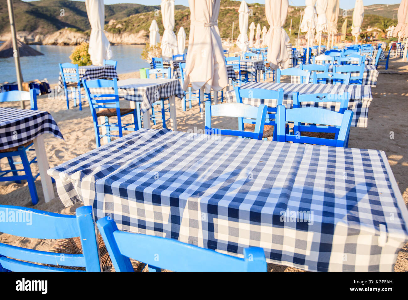 Greek taverna tables on the beach , traditional restaurant in the ...