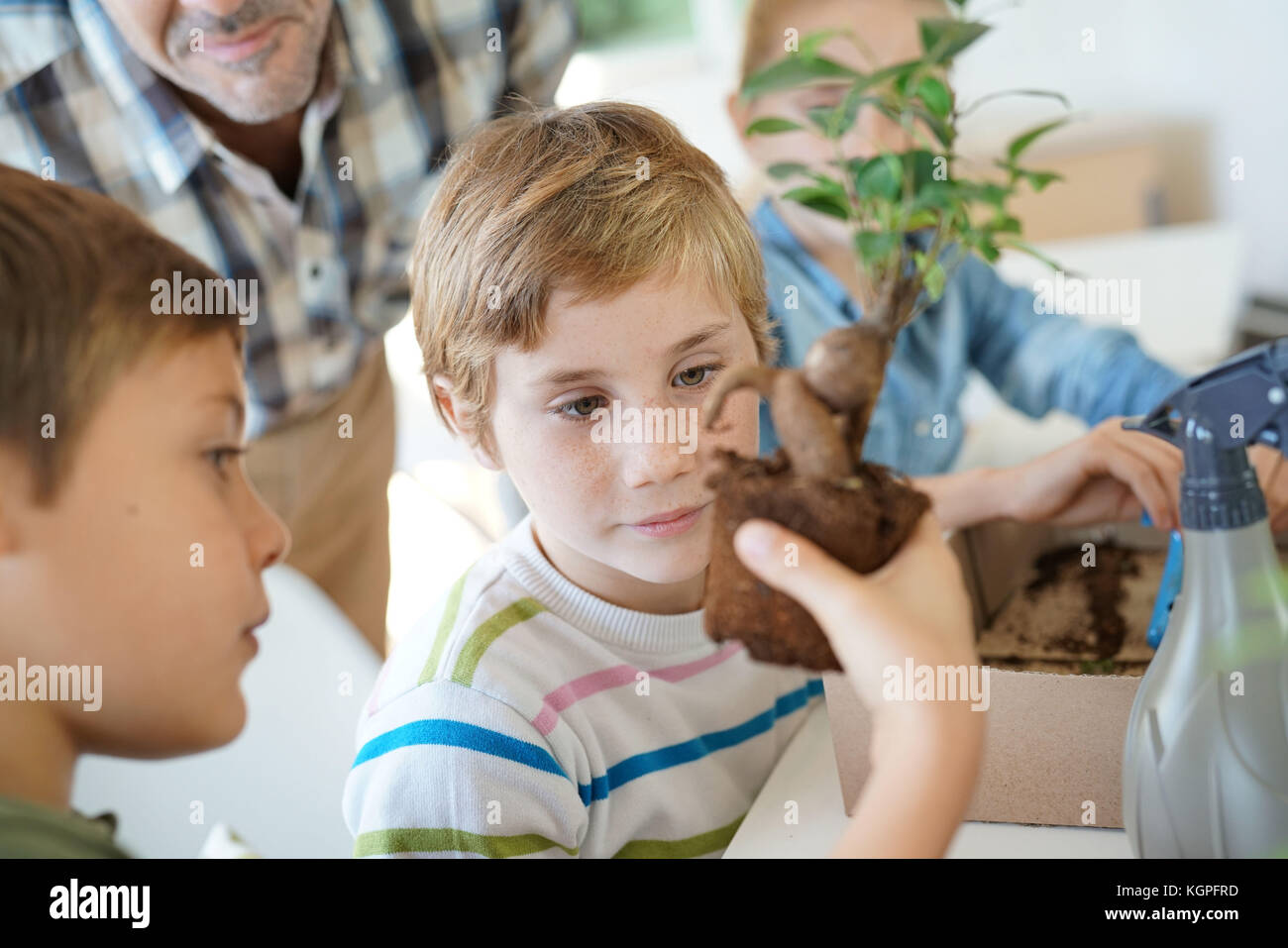 Teacher with kids in biology class learning about plants Stock Photo ...