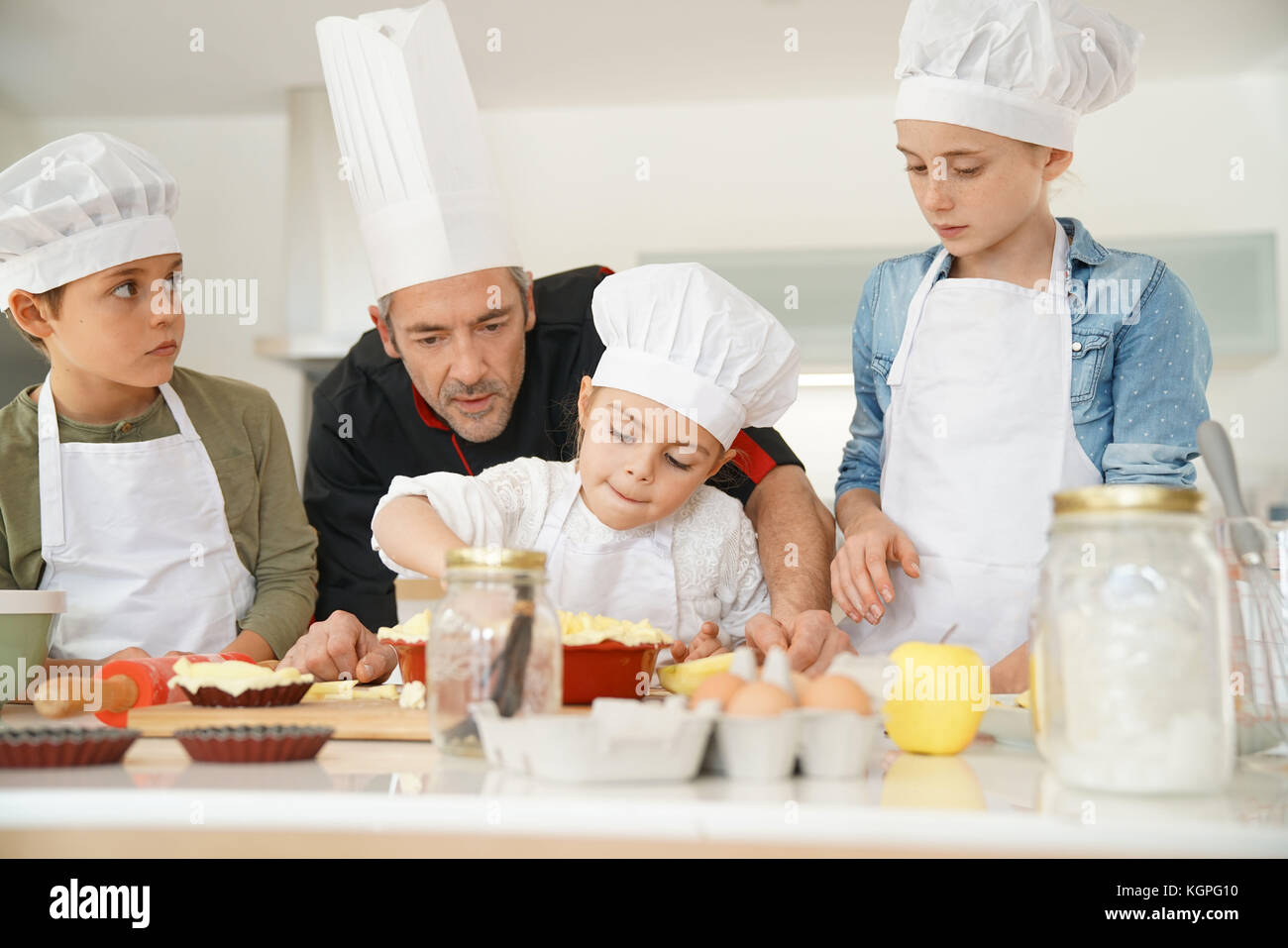 Pastry class with kids little chefs Stock Photo - Alamy