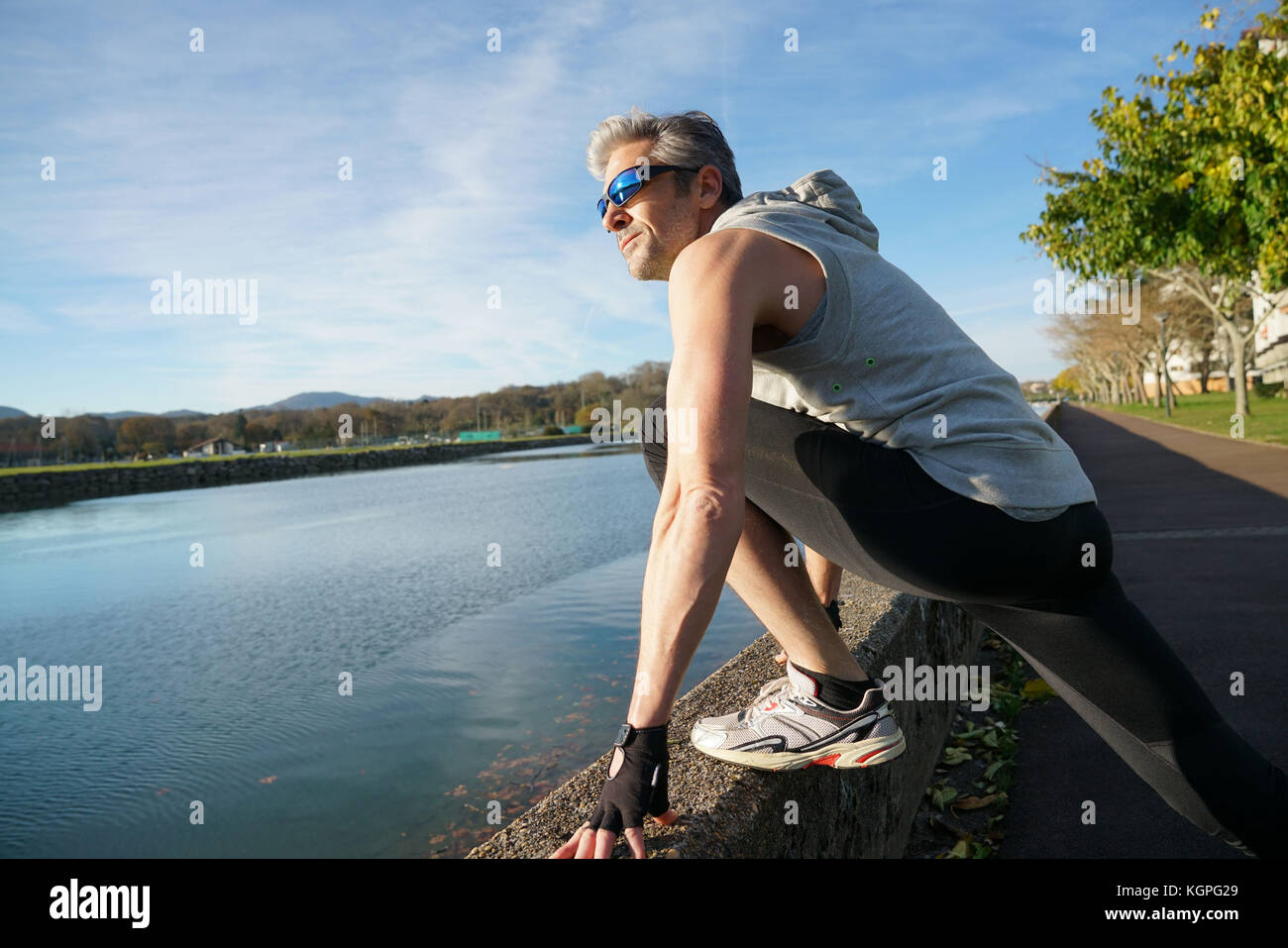 Mature man exercising outside in the morning Stock Photo - Alamy